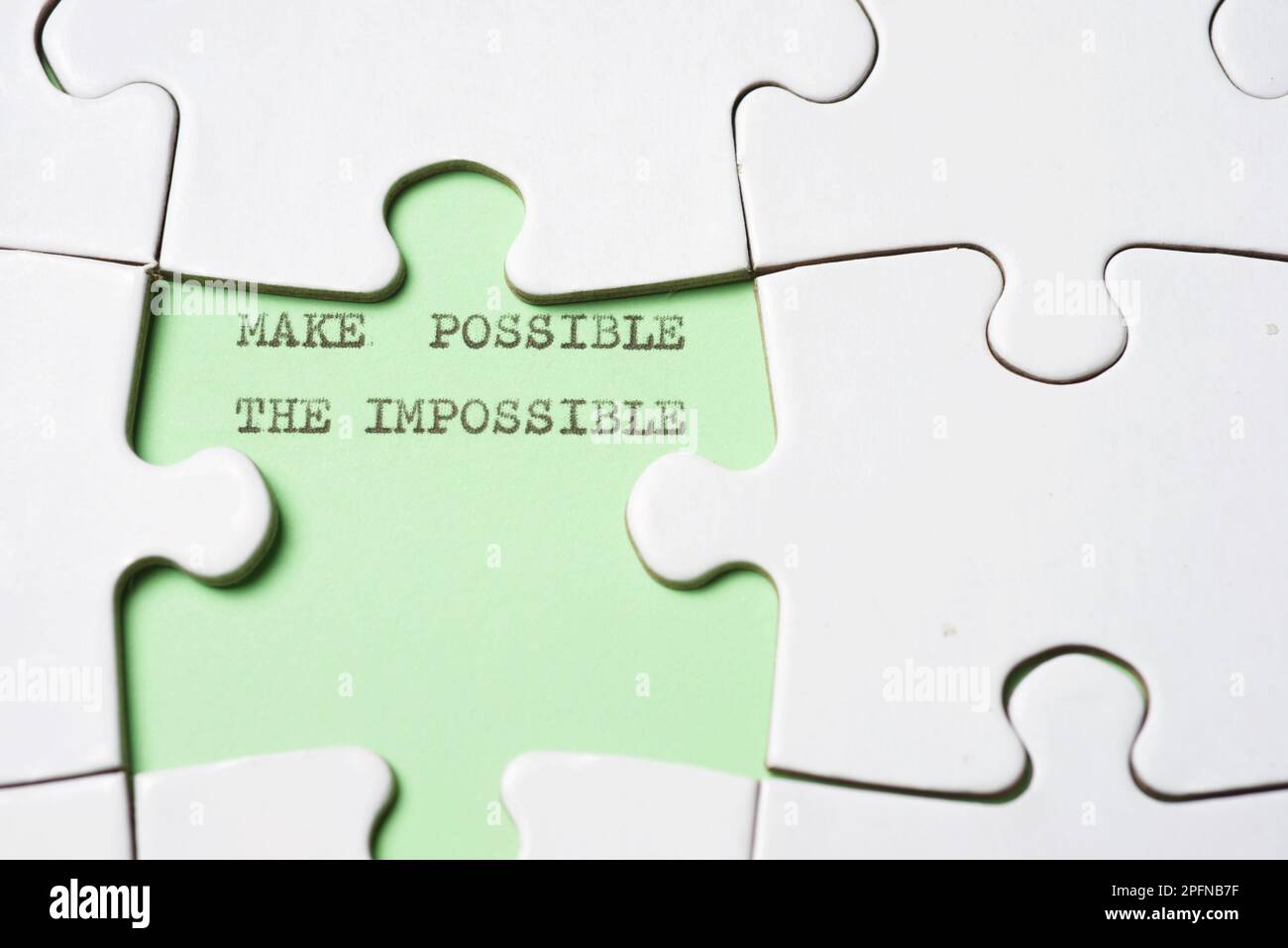 Make possible the impossible text written with a typewriter in a white ...