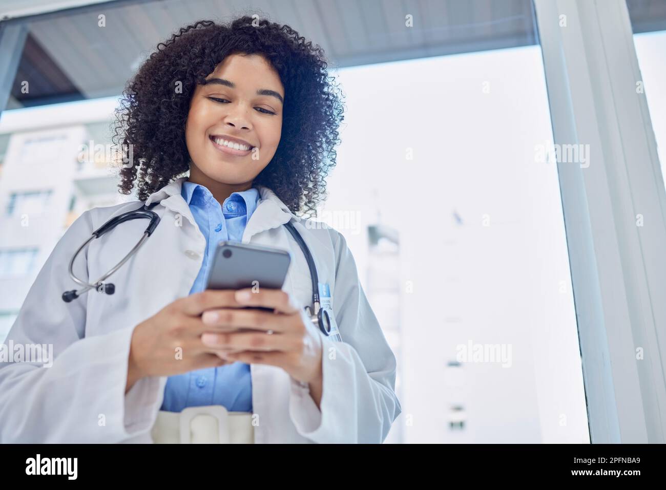 Phone, healthcare and woman doctor with mobile app, network or ...