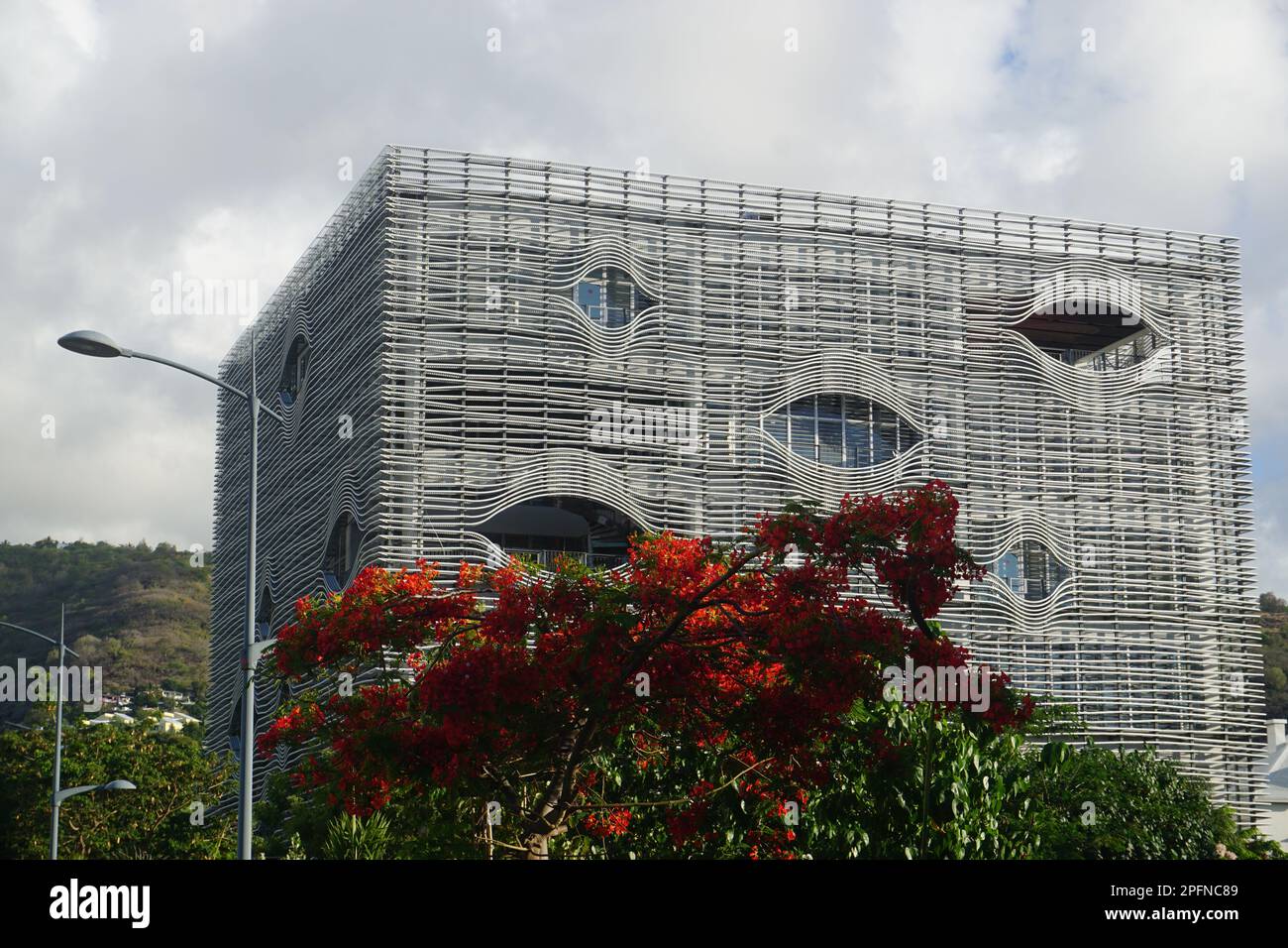 landscape scene of the unusual library building on the tropical island ...