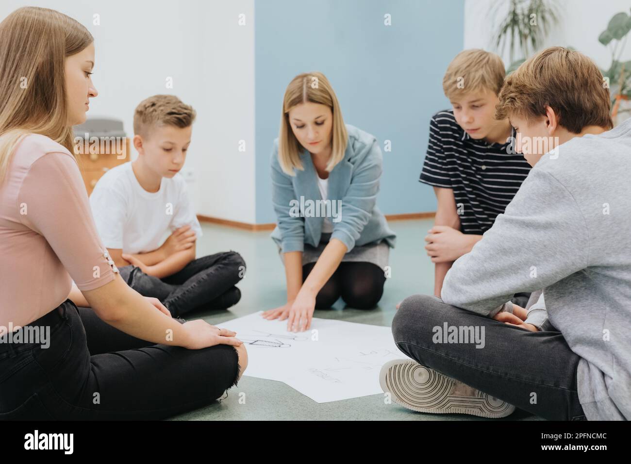 Teenage Students Sit In A Circle During Extra Maths Classes Stock Photo Teenage Students Sit In A Circle During Extra Maths Classes Stock Photo