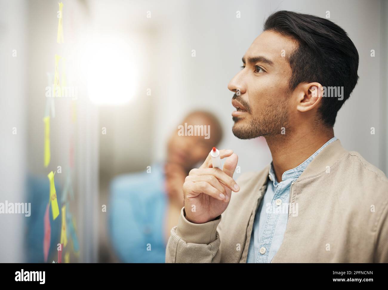 Asian man, thinking and planning business schedule for project, tasks ...