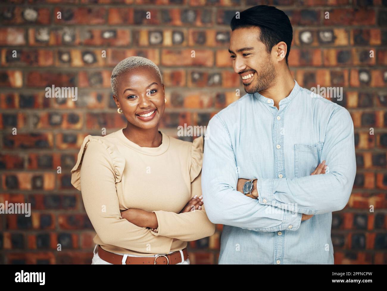 Young, professional team and partnership, teamwork with smile and arms ...