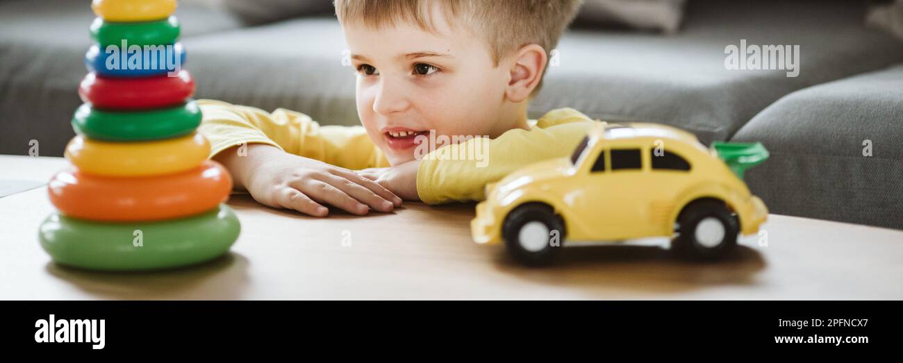 Young school kid with autism playing with kids on a therapy Stock Photo ...