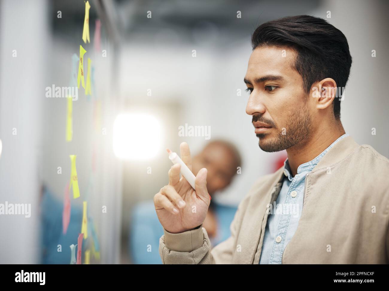 Asian man, thinking and planning business schedule for brainstorming ...