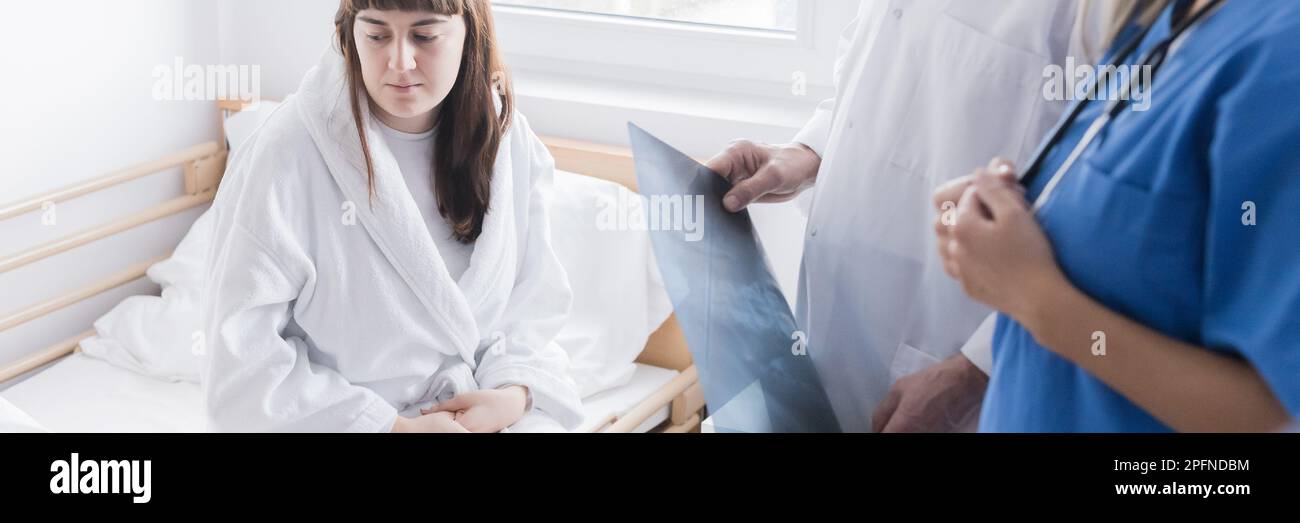 Bright hospital room with helpful doctors and ill patient Stock Photo ...