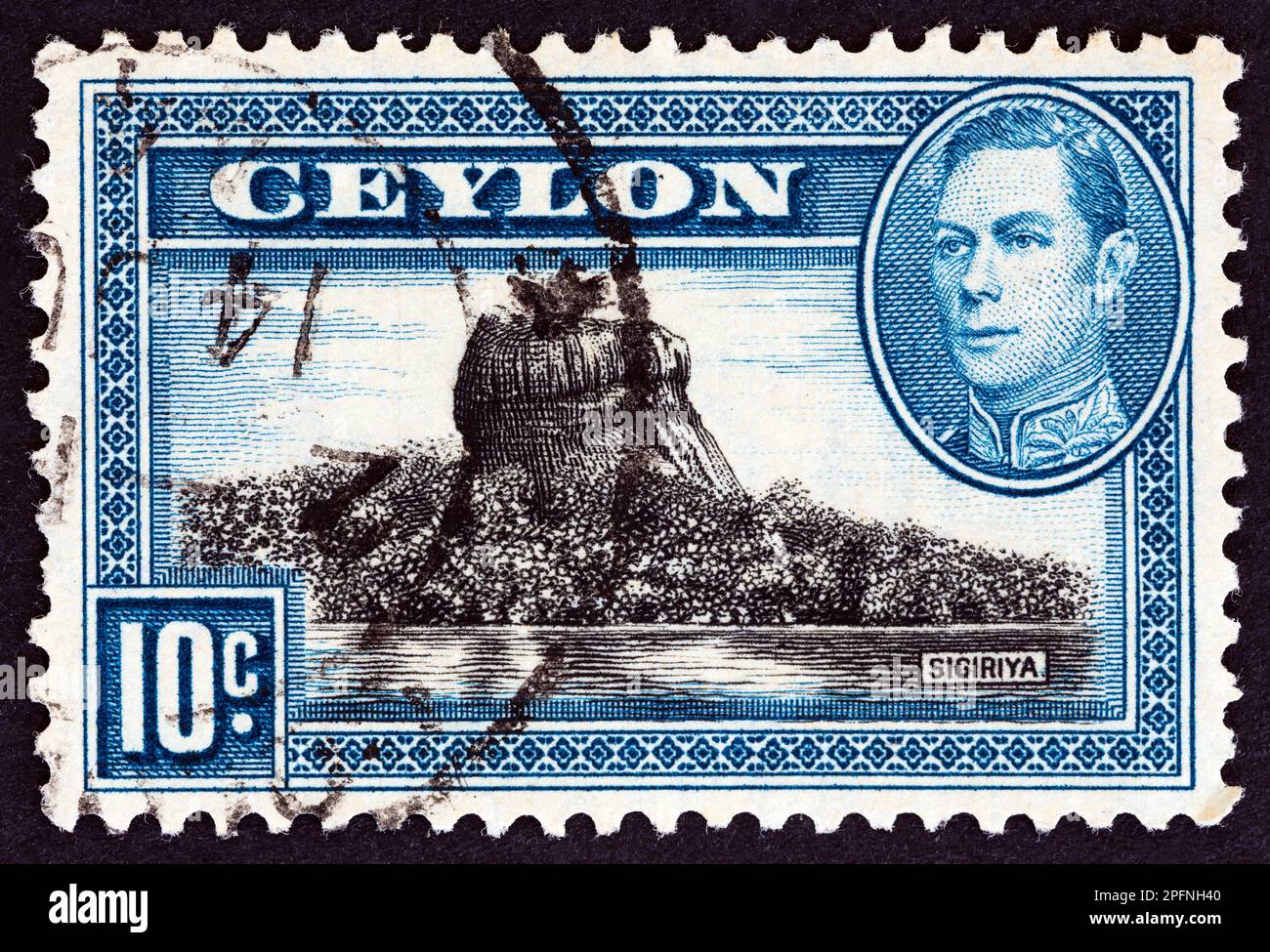 CEYLON - CIRCA 1938: A stamp printed in Ceylon shows Sigiriya (Lion ...