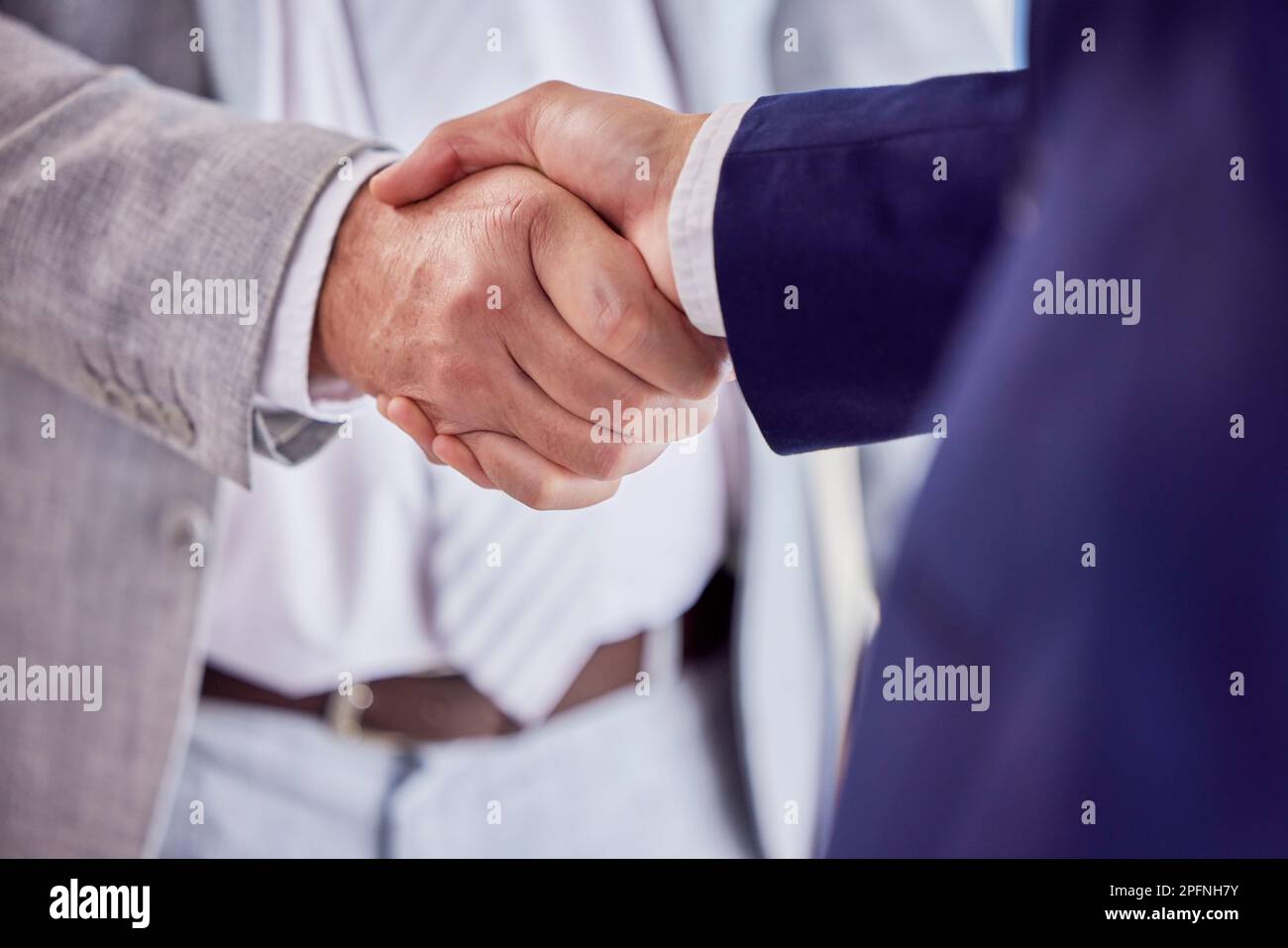 Closeup, business and handshake with employees, staff and collaboration ...