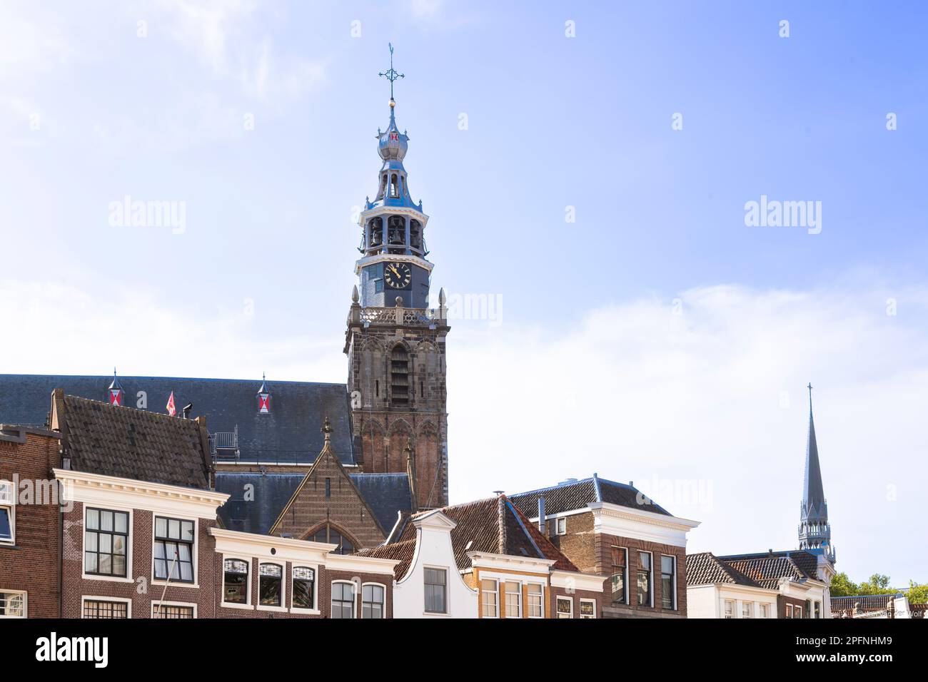 Sint Janskerk with bell tower and facades of city buildings on the ...