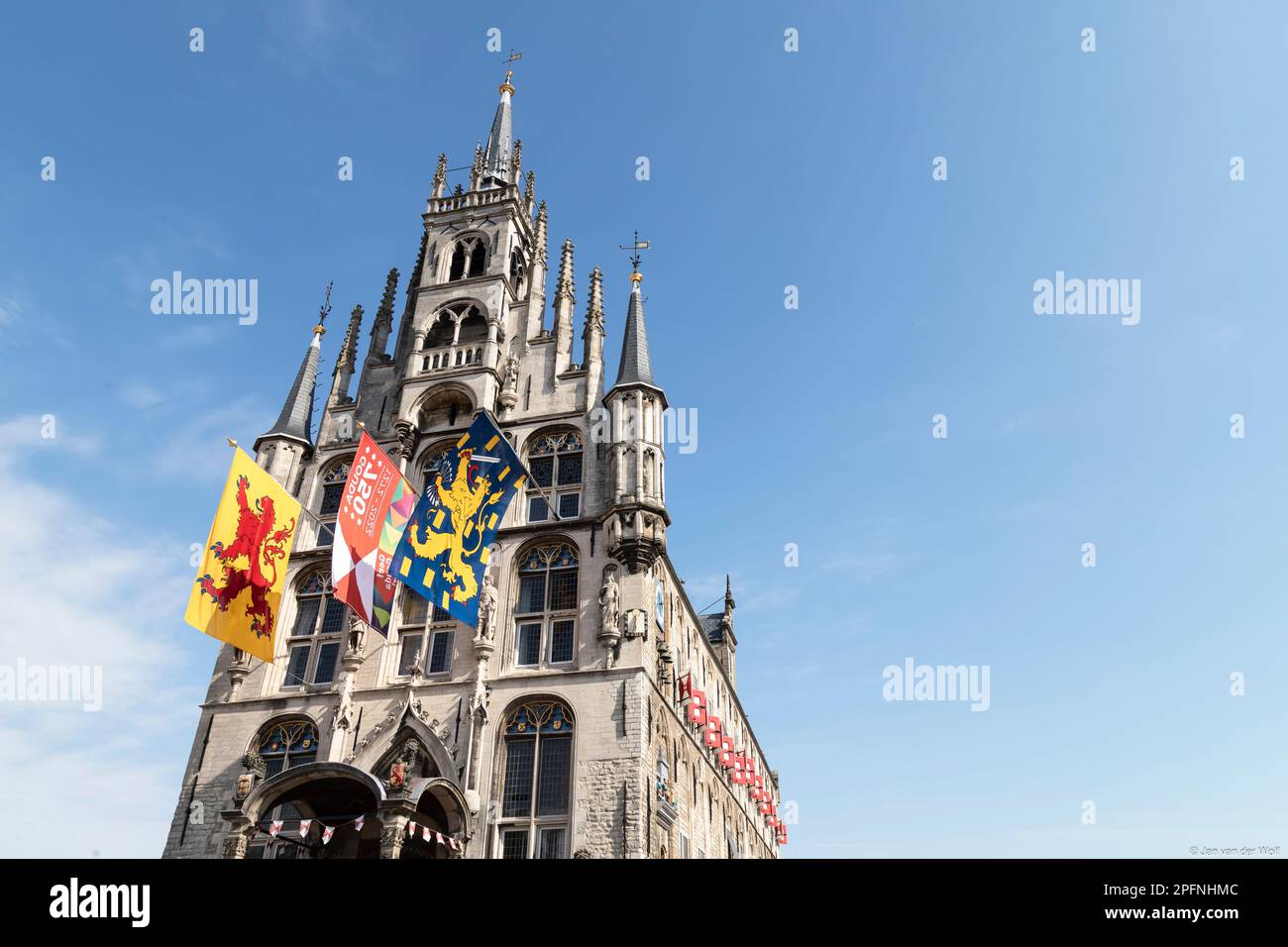 Old town hall with three different flags on the Markt of Gouda during ...