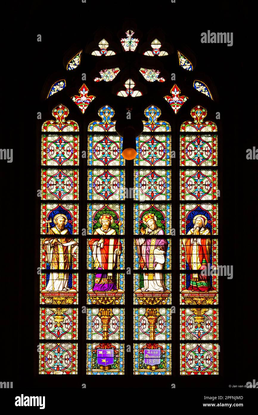 Stained glass window depicting a saint performing the sacrament of Holy ...