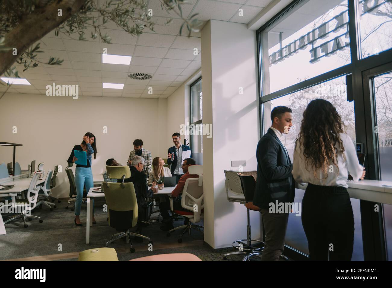 Many business people working at the co working space while sitting and ...