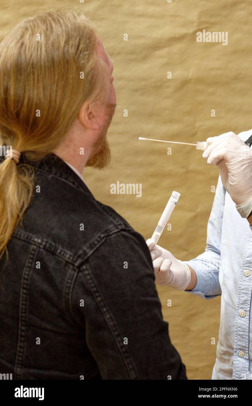 Cologne, Germany. 18th Mar, 2023. A police officer demonstrates how to ...