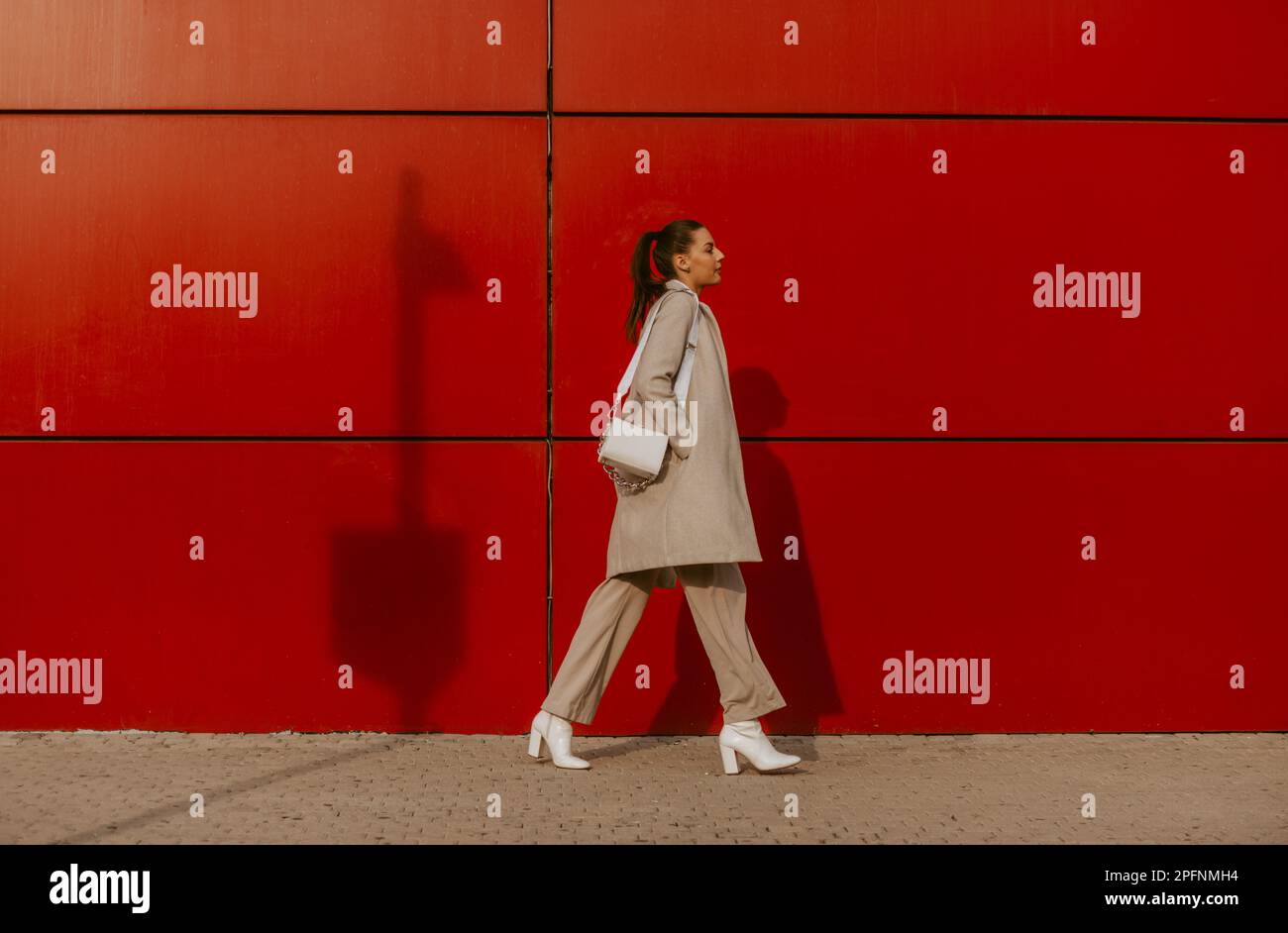 A side view photo of lovely business girl walking forward. Side view ...