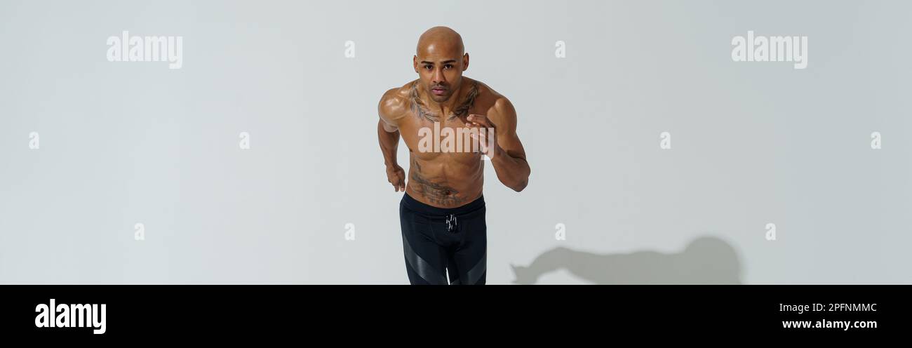Top view of Professional male athlete running isolated on white studio ...