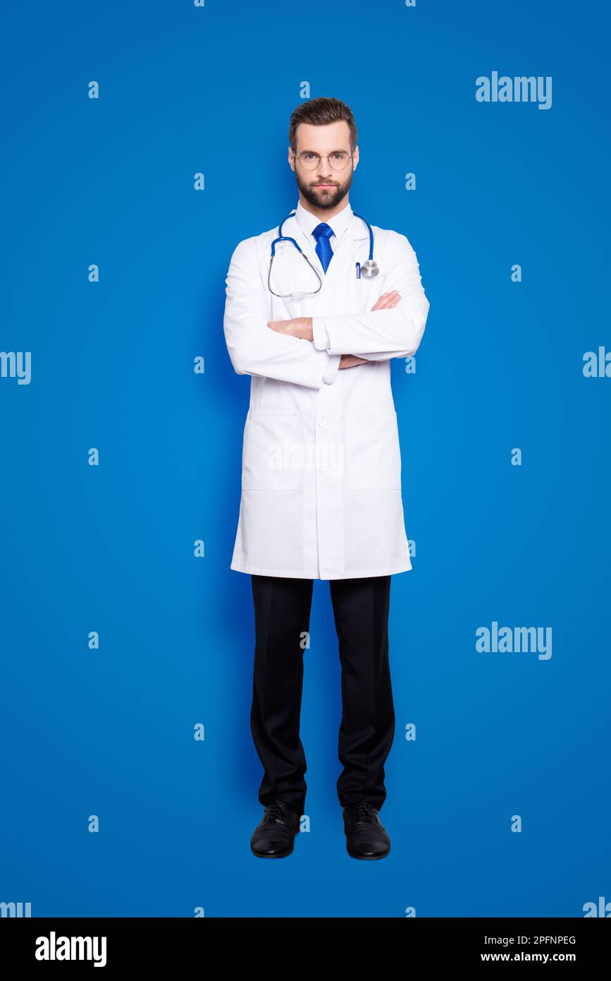 Full size portrait of attractive concentrated doc with stubble in white ...