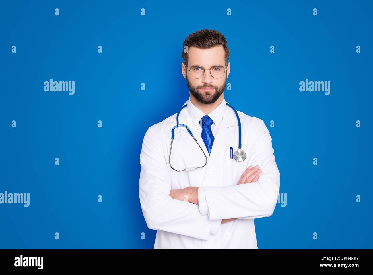 Portrait of attractive stylish doc with stubble in white lab coat, tie ...