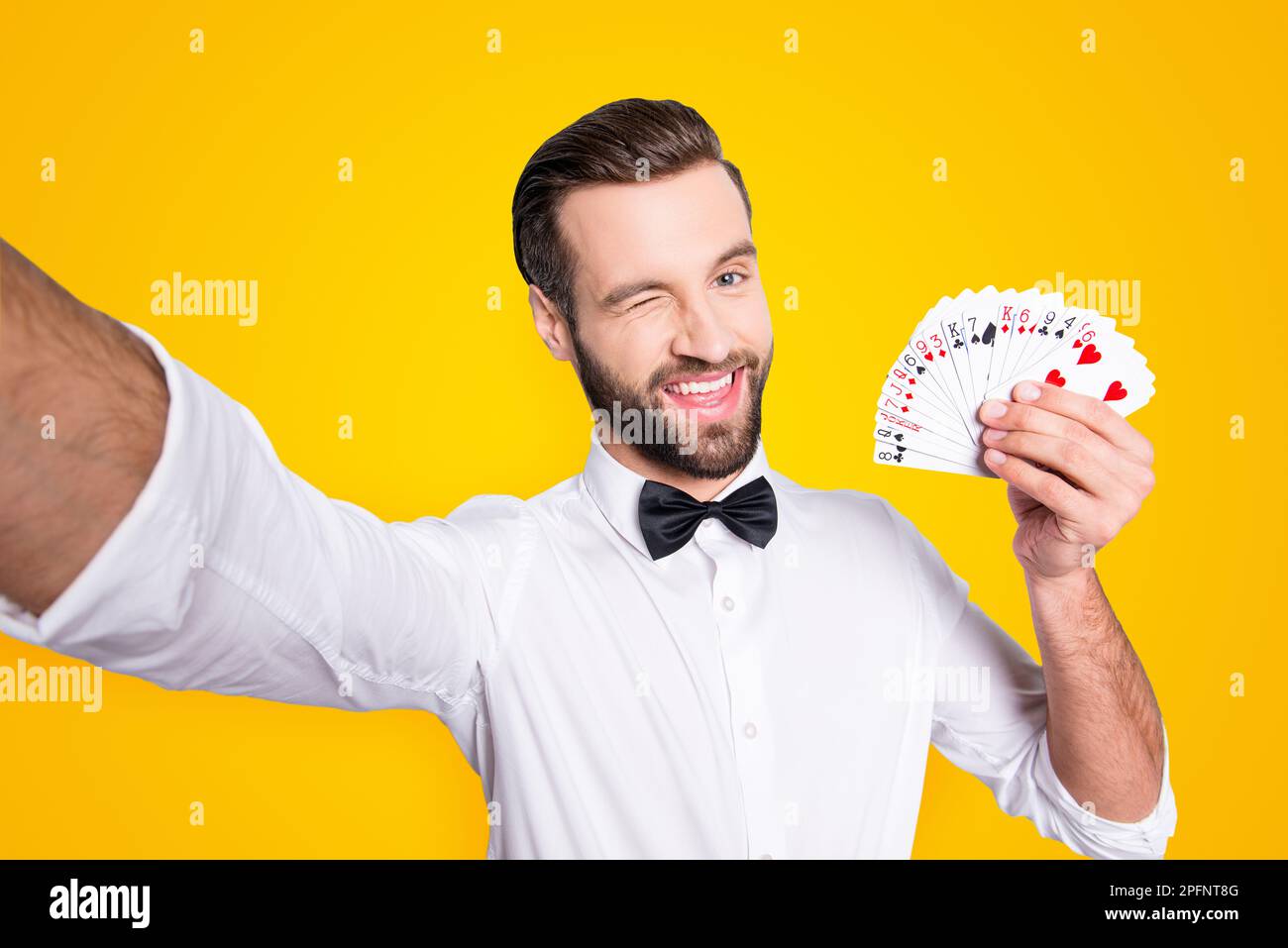 Self portrait of playful flirting croupier shooting selfie on front ...