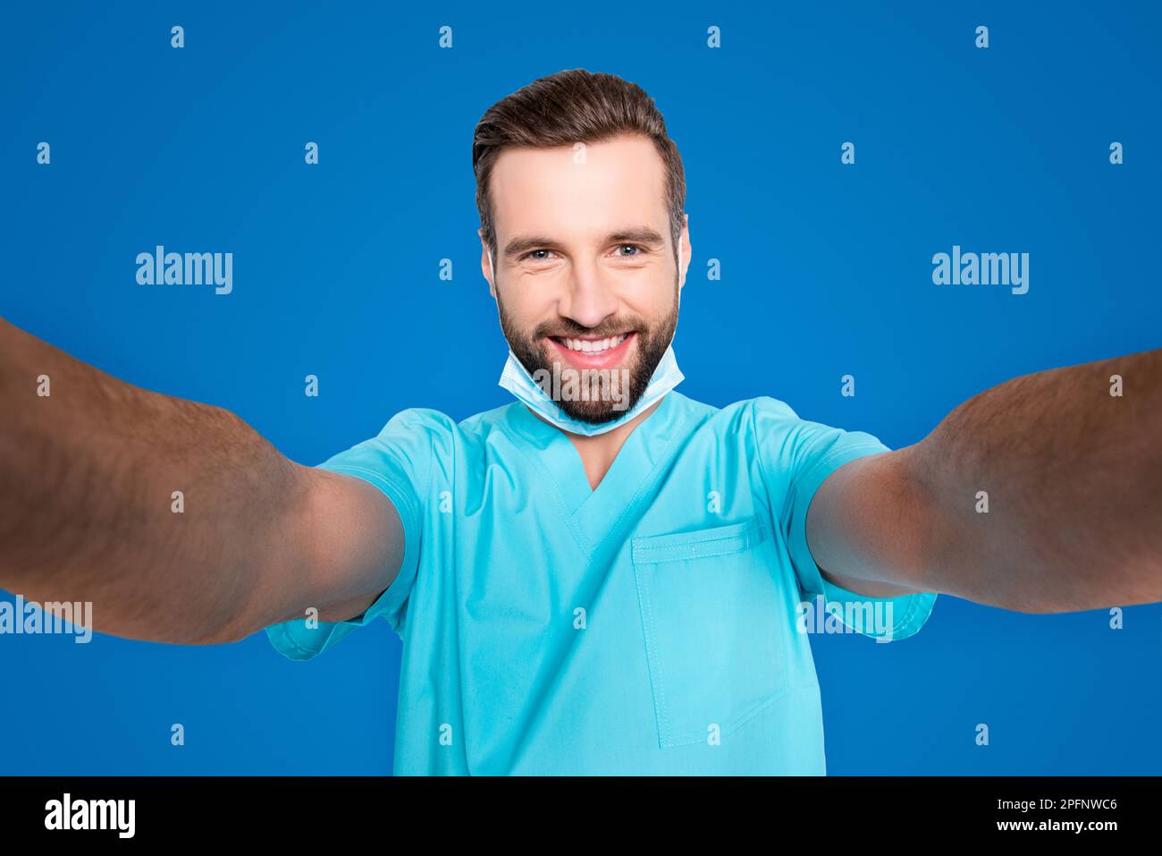 Self portrait of attractive cheerful man with stubble shooting selfie ...