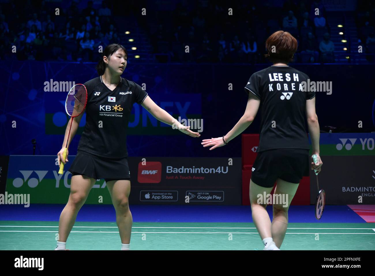 South Korea's Baek Ha-na, left, and Lee So-hee, right, touch hands during their women's double ...