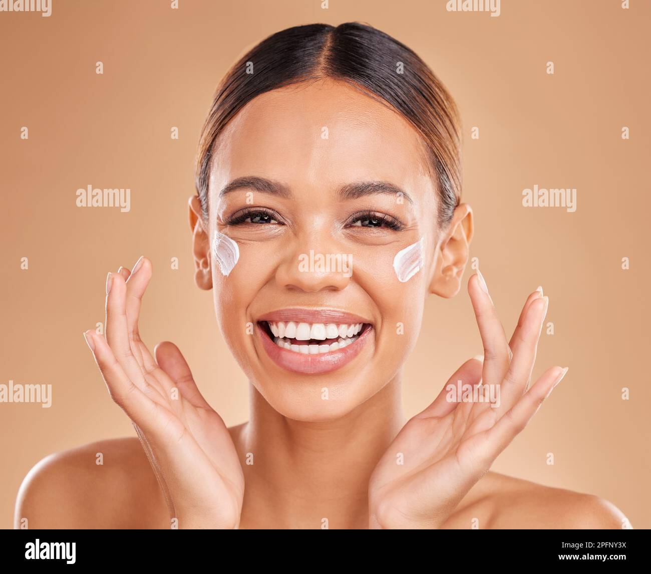 Face, funny skincare and woman with cream in studio isolated on a brown ...