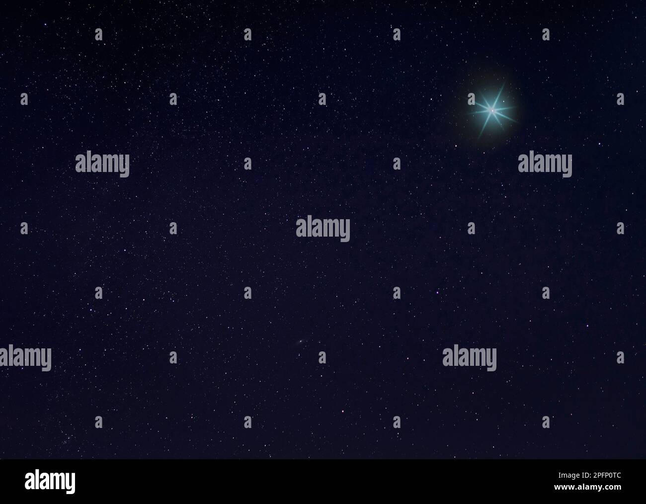 Bright blue star in the night sky with room for text Stock Photo - Alamy