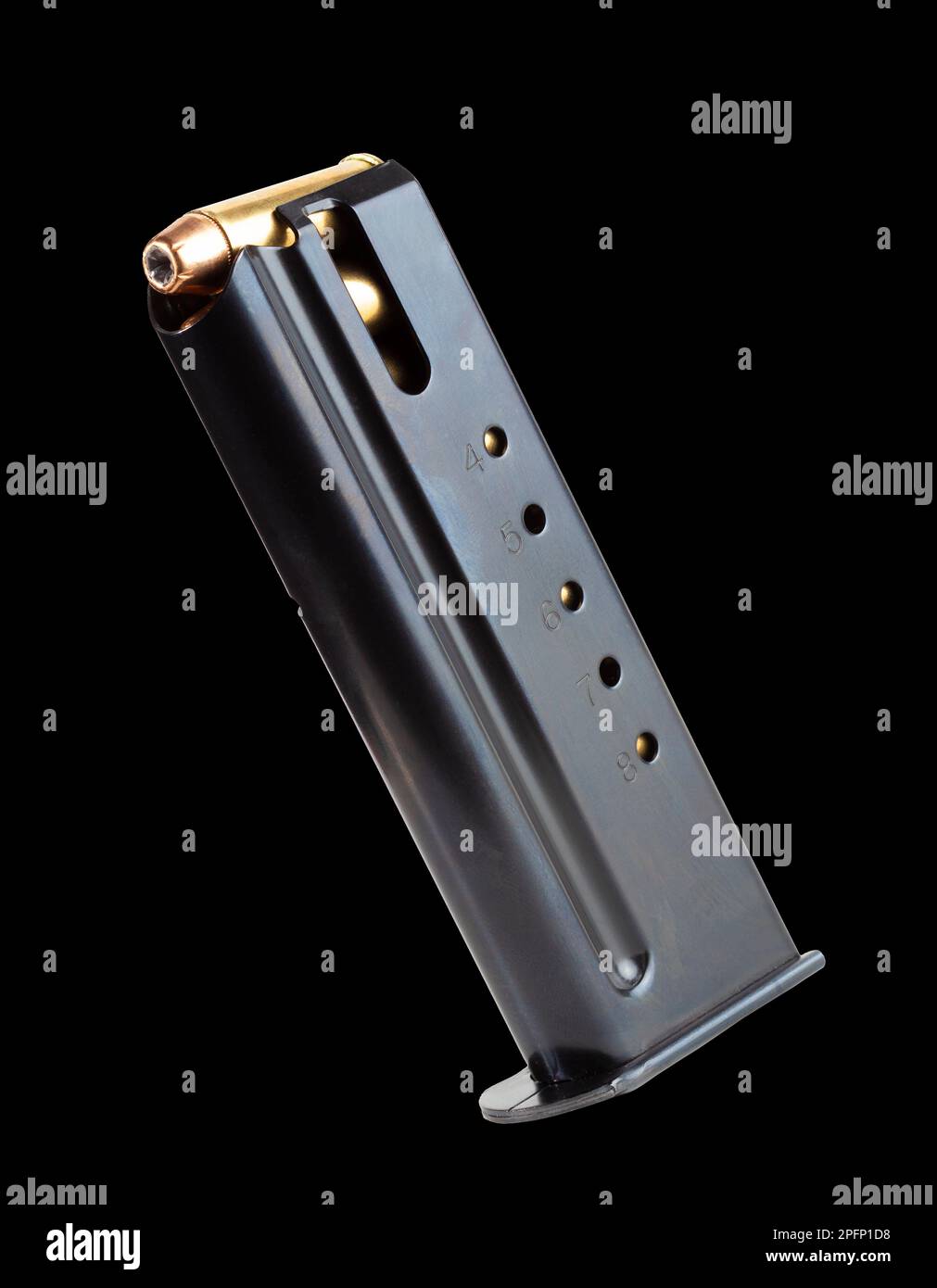 Full length pistol magazine loaded with hollow points on a black ...