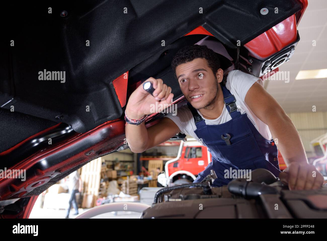 Mechanic man lamp repairing car hi-res stock photography and images - Alamy