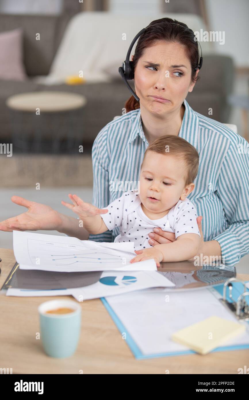 mother trying to work from home while looking after kid Stock Photo - Alamy