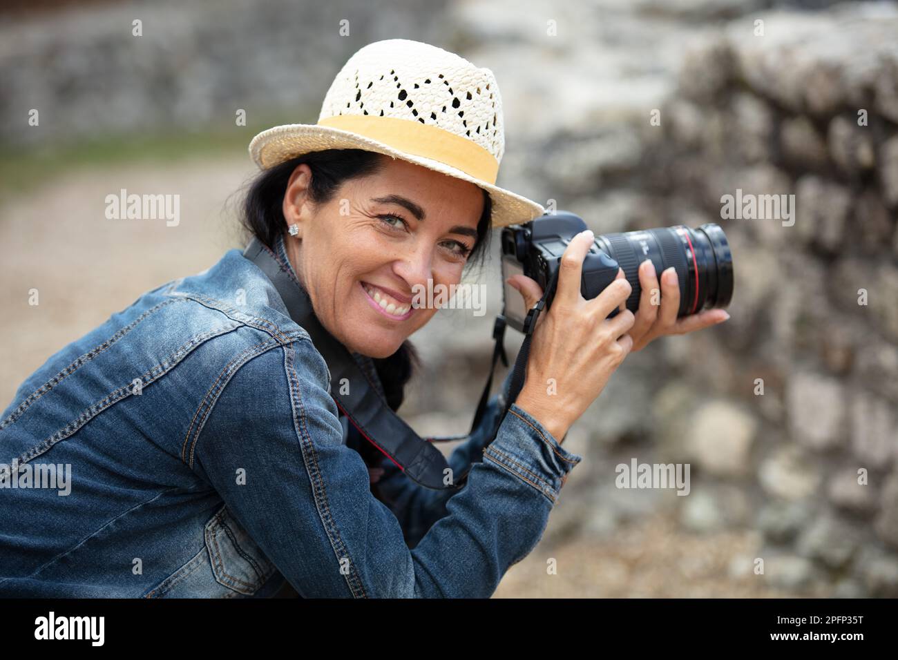 photographer woman woman taking a photos with dslr camera Stock Photo ...