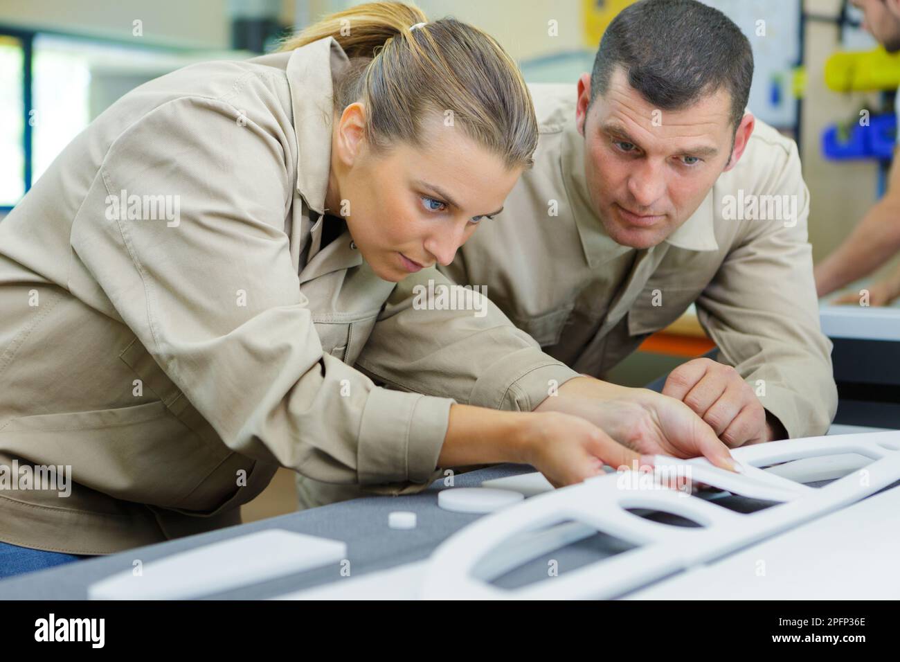 woman fixing something in factory Stock Photo - Alamy