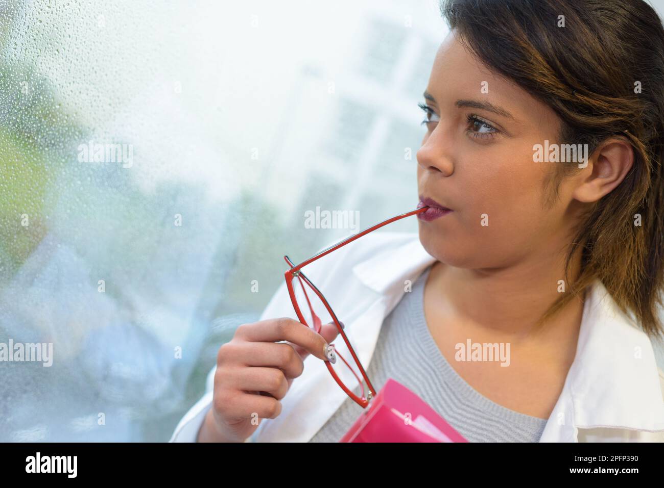 picture of young woman thinking deeply Stock Photo - Alamy
