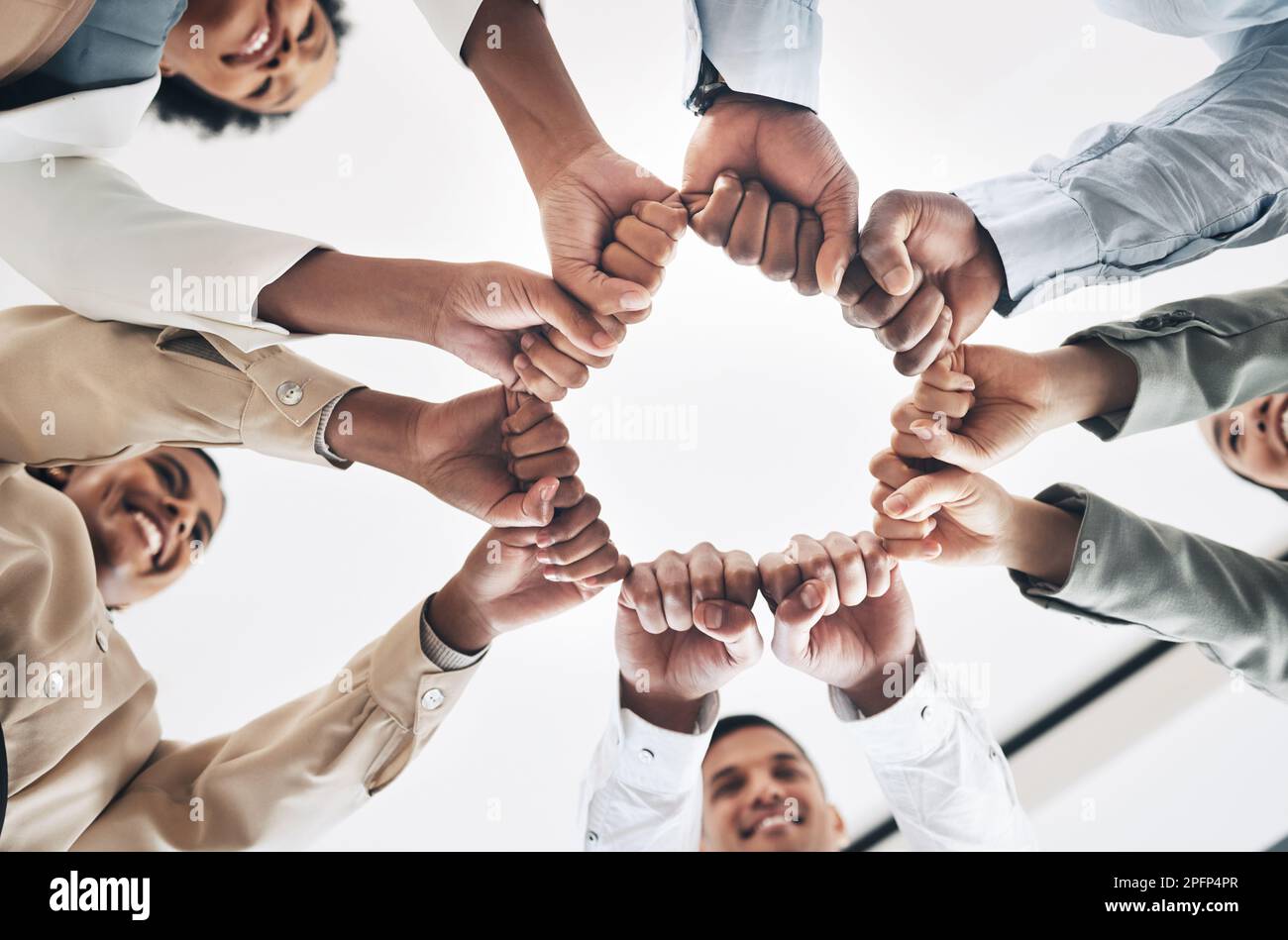 Team building, circle or happy business people fist bump for motivation ...