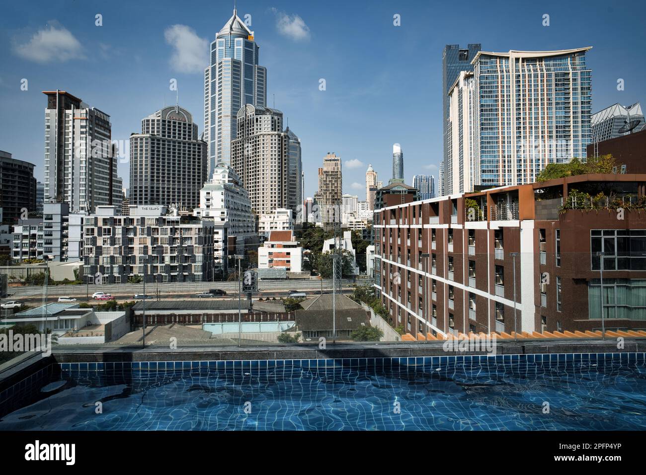 The Bangkok skyline seen from the rooftop swimming pool at the Hotel ...