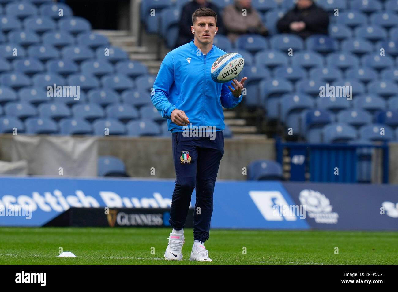 Tommaso Allan #15 of Italy juggles the ball while he inspects the pitch ...