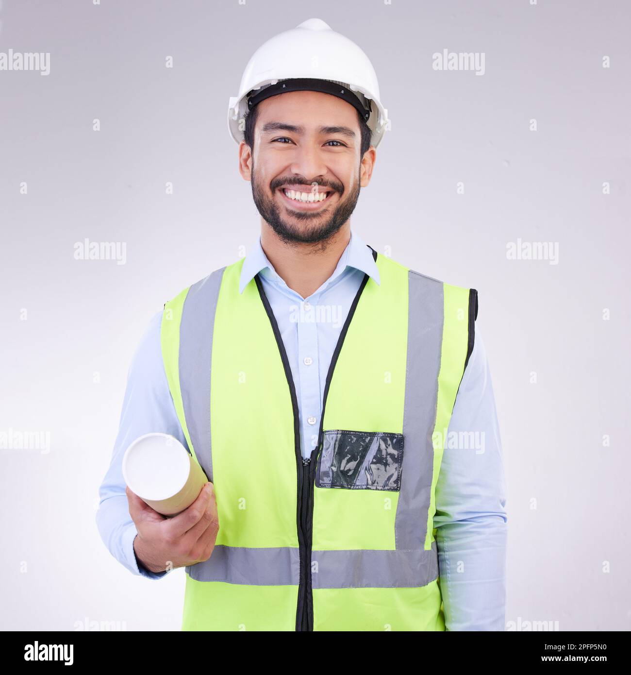 Construction worker man in portrait isolated on a white background ...