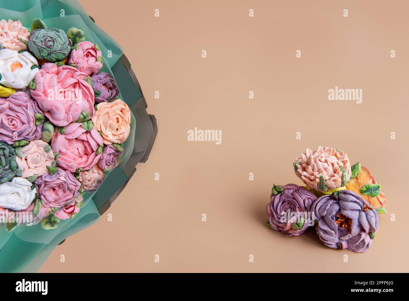 Festive bouquet of sweet sugar marshmallow rose flowers on beige ...