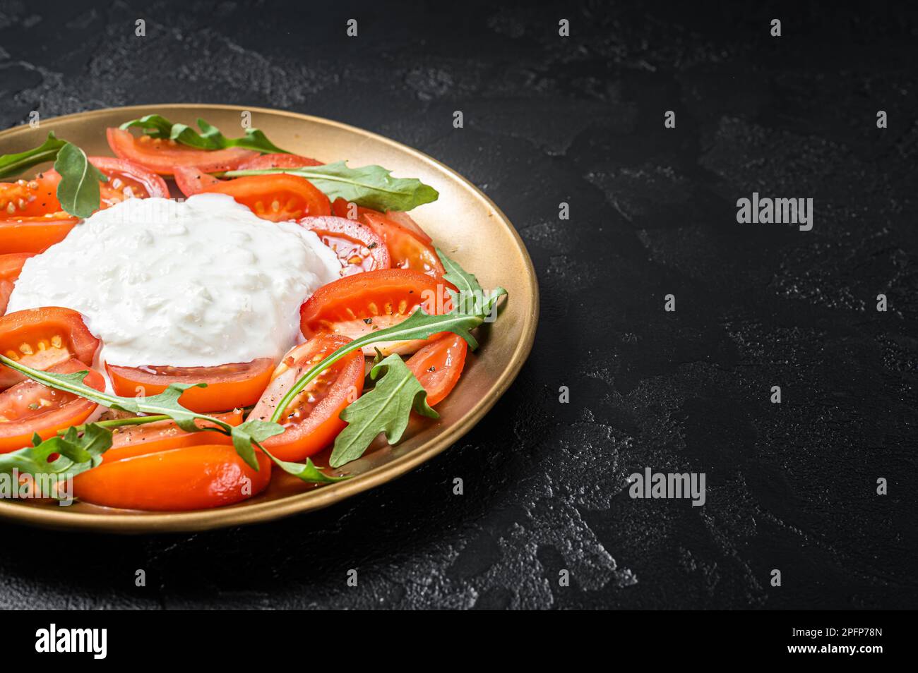 Italian salad caprese with cheese stracciatella, tomatoes and arugula ...