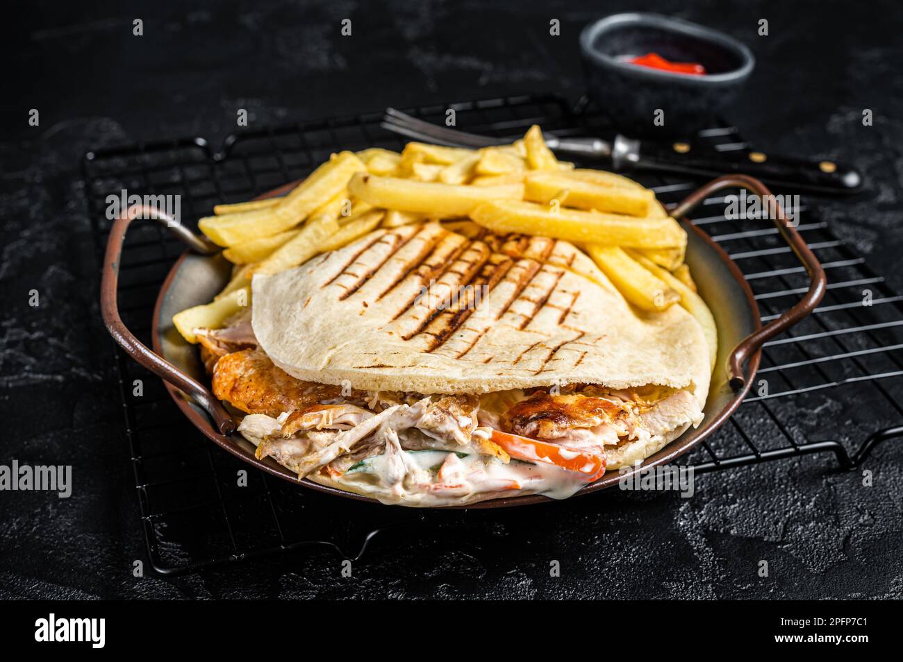 Doner kebab sandwich in grilled pita bread with vegetables and chicken ...