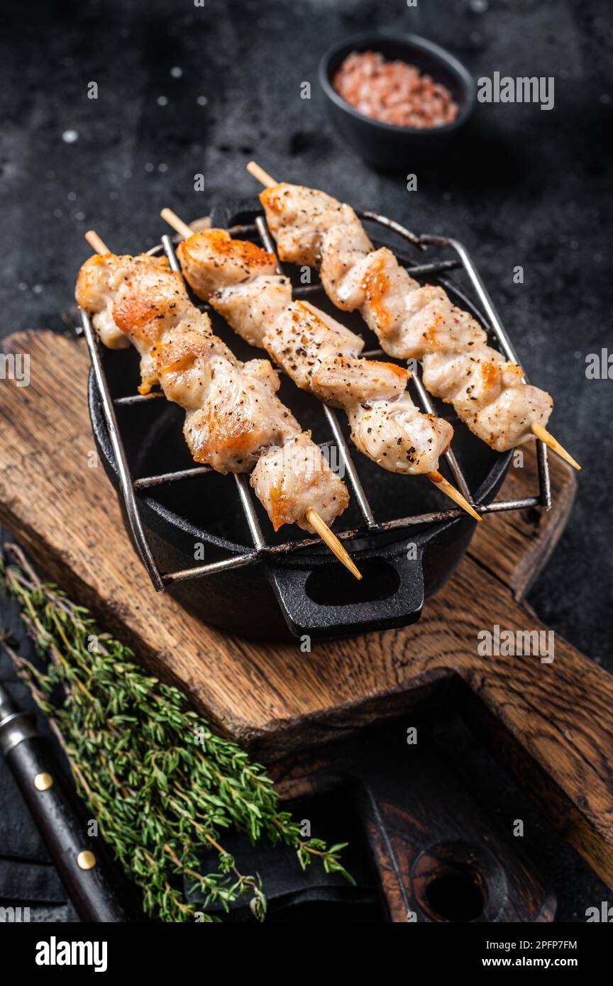 Grilled Chicken skewers souvlaki, poultry meat shish kebab. Black background. Top view Stock ...