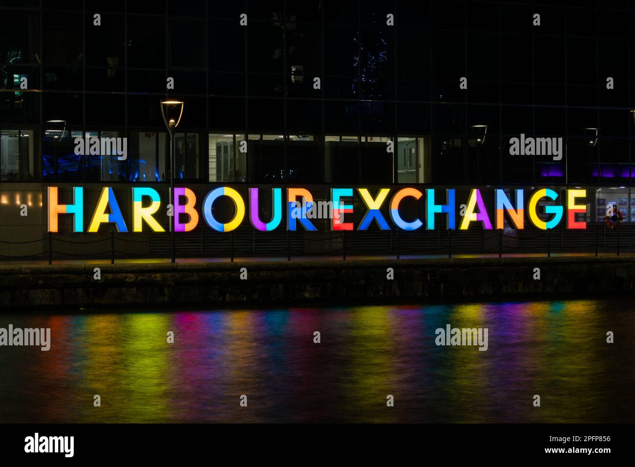 An illuminated sign for the Harbour Exchange complex on Millwall Inner ...