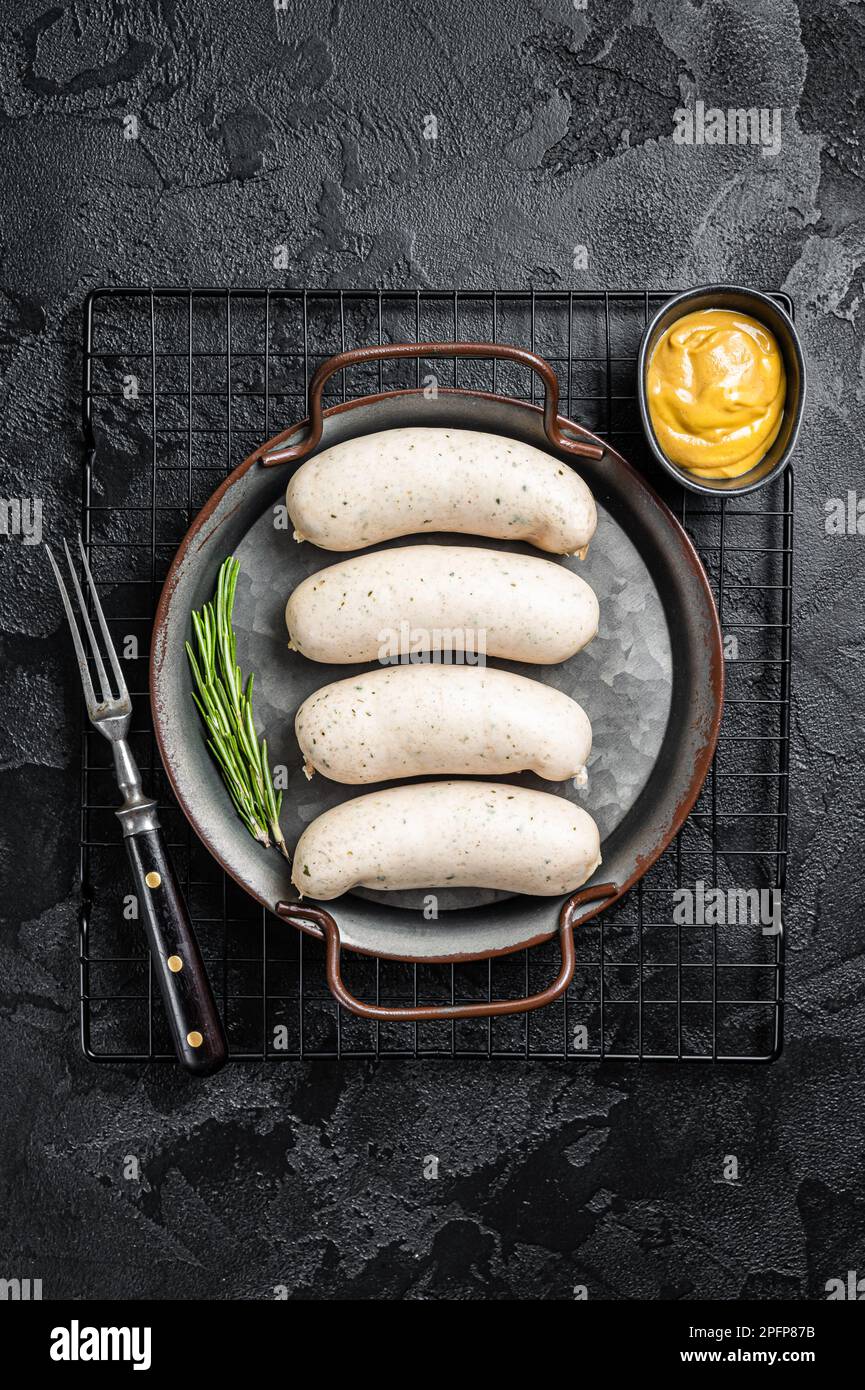 Traditional German Bavarian white sausage in steel tray with mustard ...