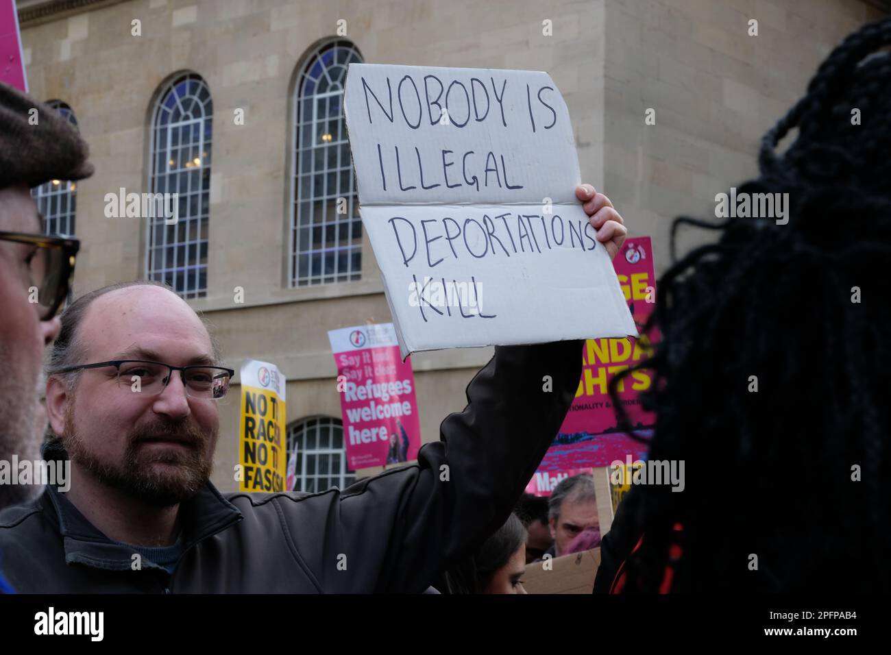 London, UK. 18th Mar, 2023. A person holds a banner during the Resist ...