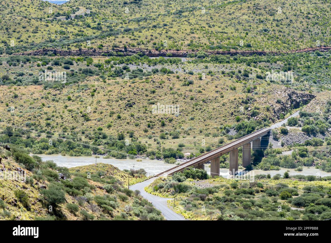 Single lane road bridge over the Orange River below the overflowing ...