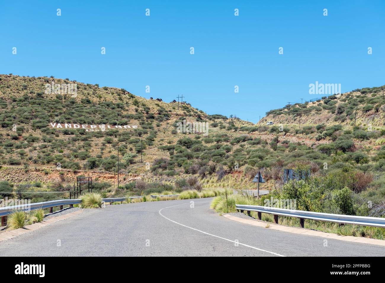 Road to the dam wall of the Vanderkloof Dam in the Orange River. The ...