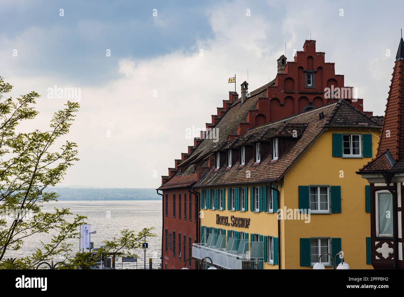 A traditional German building hotel with a sign in front, and clear ...