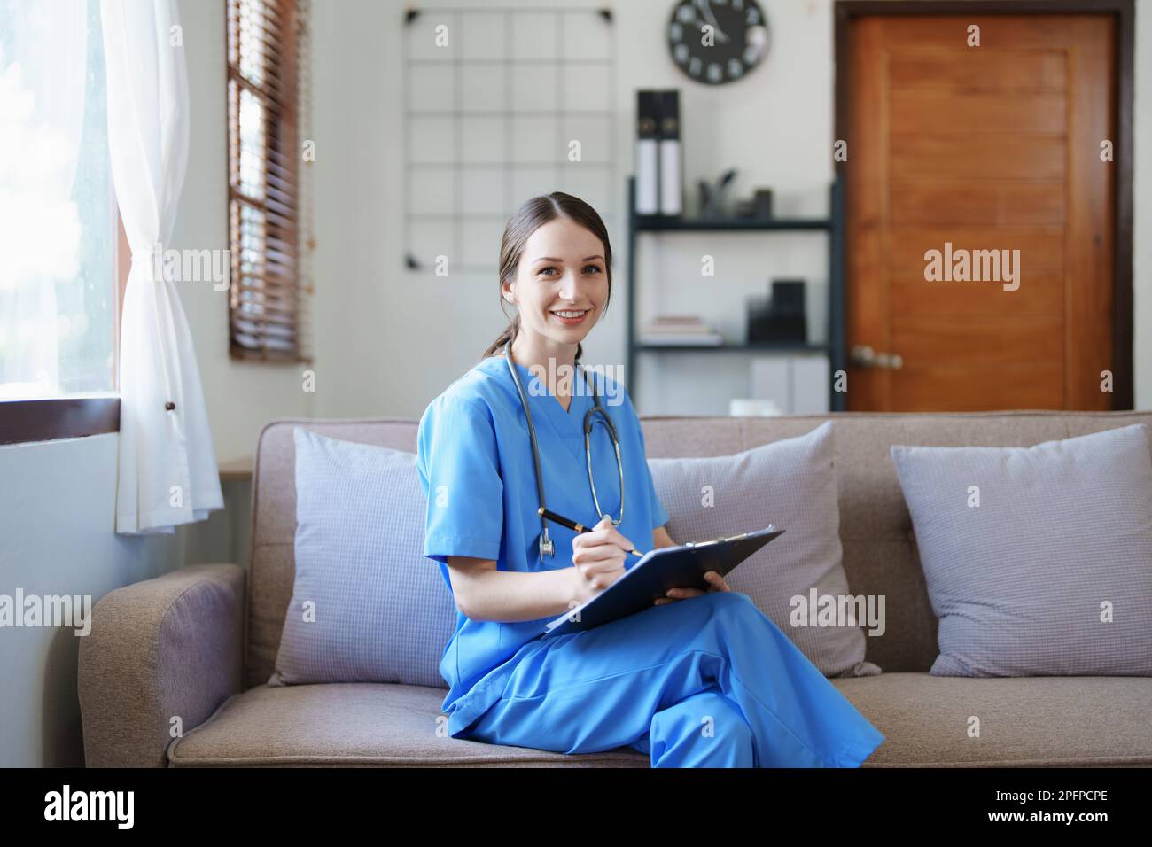 Portrait of female doctor holding patient diagnosis papers Stock Photo ...