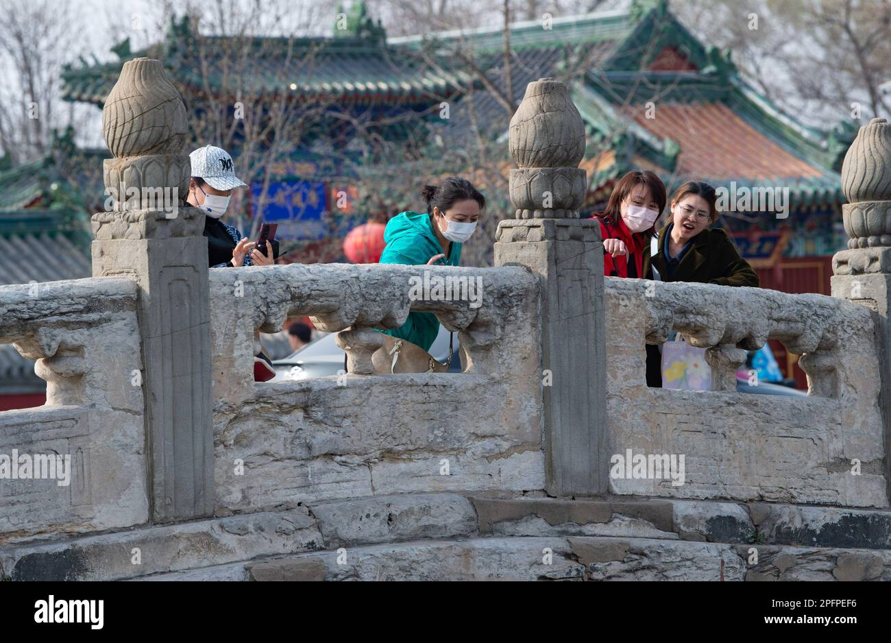 Beijing, China. 8th Mar, 2023. Pedestrians are pictured on the restored ...