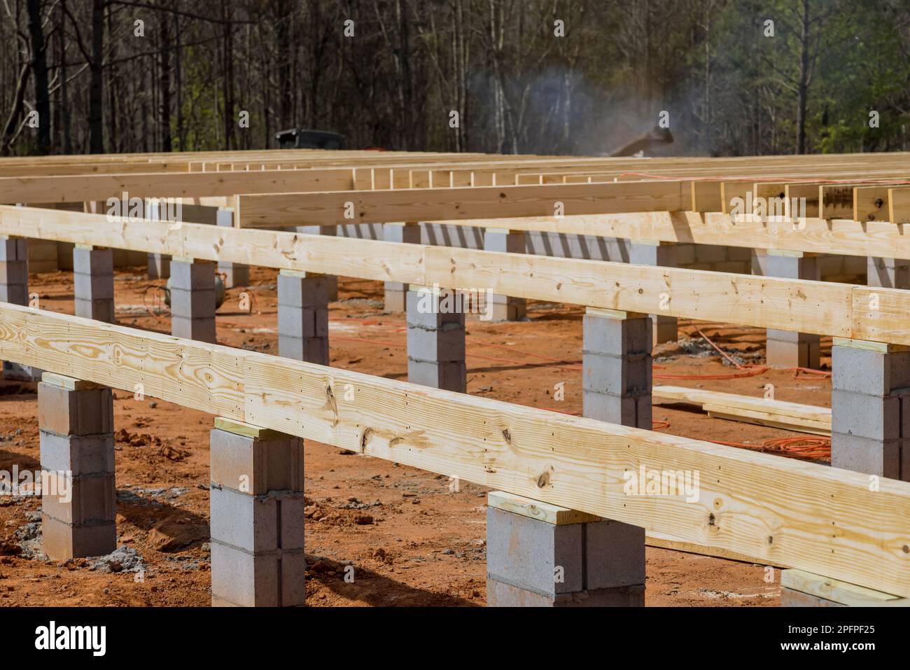 Layout of wood floor joists on concrete block foundation for new house ...