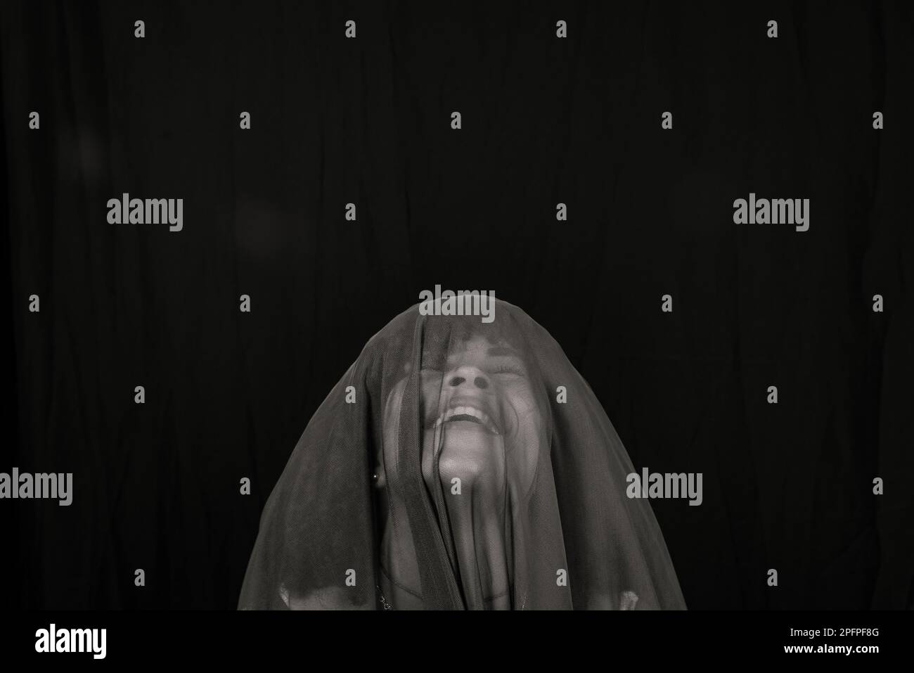 Black and white portrait of a womans face covered with cloth. Isolated ...