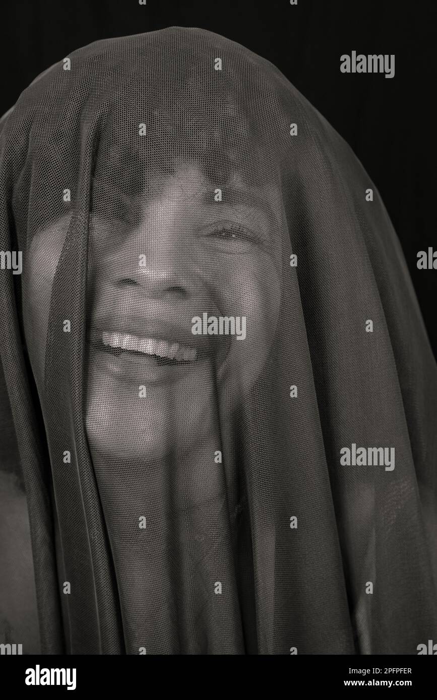 Black and white portrait of a womans face covered with cloth. Isolated ...